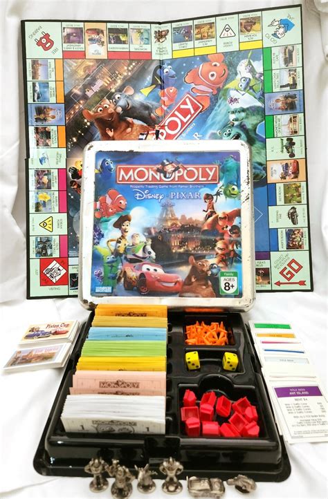 Monopoly Disney Pixar Board Game In Metal Tin 6 Tokens 28 Title Deed