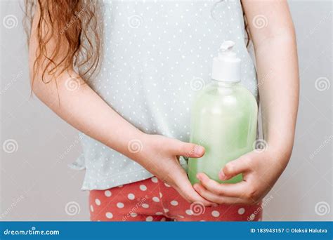 Girl Holding A Bottle With Liquid Soap Stock Image Image Of Nails