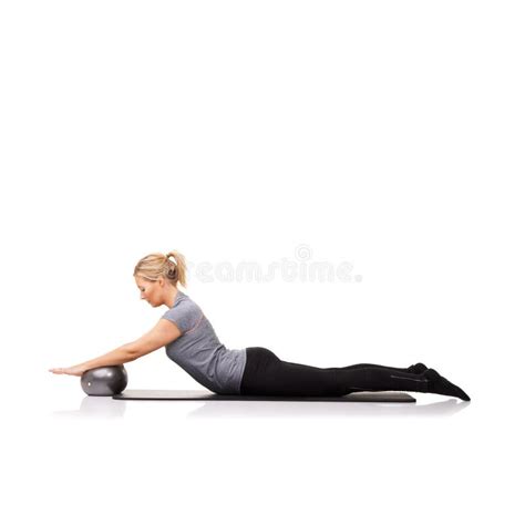 Arching Her Back And Forcing It Down A Young Woman Using An Exercise