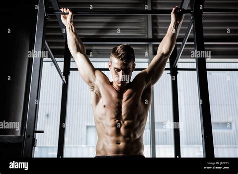 Shirtless Man Doing Pull Up Stock Photo Alamy