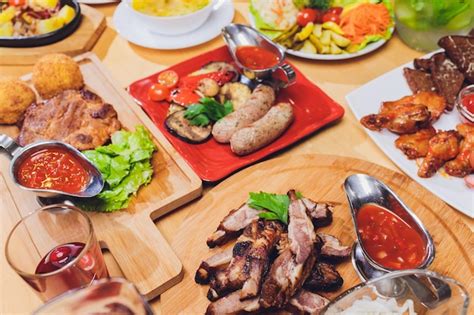 Premium Photo Dining Table With A Variety Of Snacks And Salads Salmon