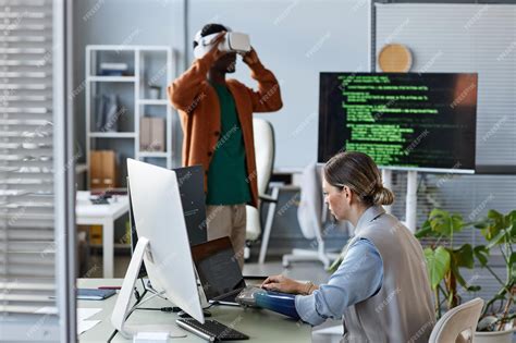 Premium Photo Developer With Bionic Arm Creating Software For Vr Headset