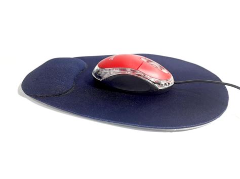 Premium Photo The Computer Mouse That Is Being Used Underneath There Is A Mouse Pad