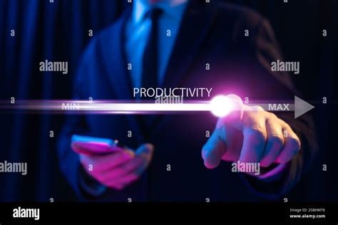 Businessman Adjusting A Virtual Slider From Minimum To Maximum Symbolizing The Process Of