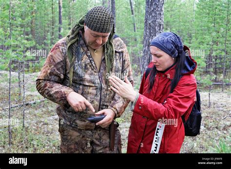 Scientists In The Forest Remove The Data Coordinates For Gps Navigator