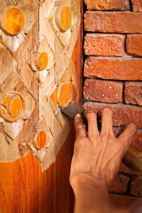Carving Wooden Round Pole By Chisel With Thai Traditional Pattern Stock