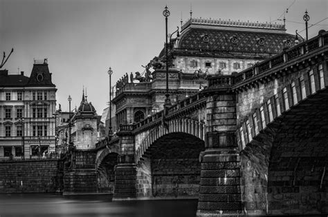 Premium Photo River Passing Through Arch Bridge