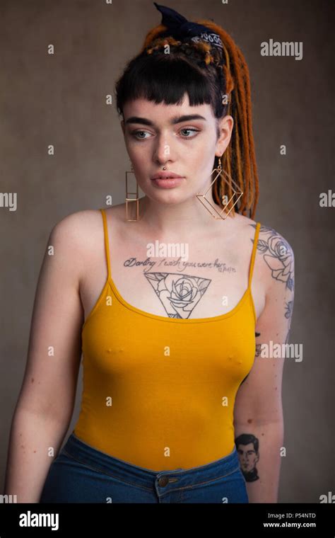 Young Adult Woman With Tattoos And Pierced Nipples Fife Scotland Stock