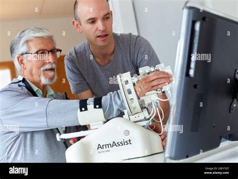 patient with assistive robot for upper limb rehabilitation the robot