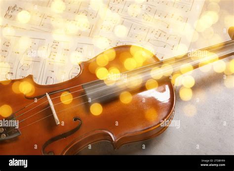 Christmas And New Year Music Violin On Music Sheets Bokeh Effect