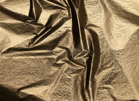 Crumpled Brass And Gold Foil Texture With A Pearlescent Shiny Finish Rough Folds And Crinkles