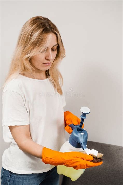 Housekeeper Is Pouring Detergent On Brush For Dry Cleaning Using