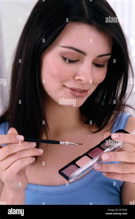 Step By Step Make Up Female With Brunette Hair Holding A Lipgloss