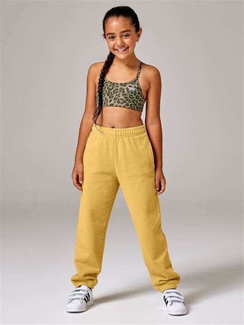 Shop Girls Trackpants Running Bare Heritage Sweatpants Yellow
