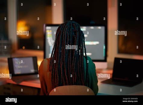 Back View Portrait Of Female It Developer Writing Code On Multiple