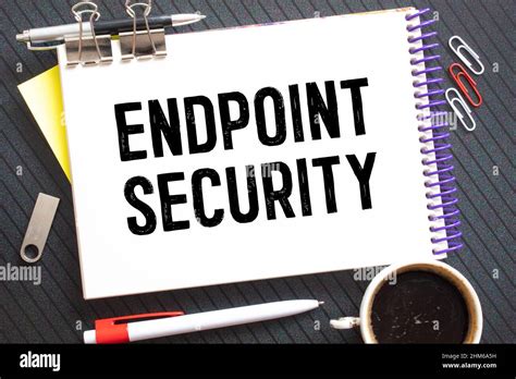 Text ENDPOINT SECURITY On Brown Paper Notepad In Businessman Hands In Office Business Concept