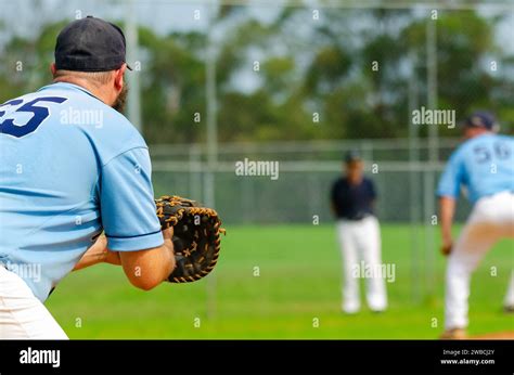 Baseball Game First Baseman Is Getting Ready To Catch A Ball From A