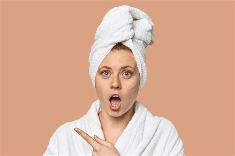 Premium Photo Young Caucasian Redhead After Shower Pointing To The Side