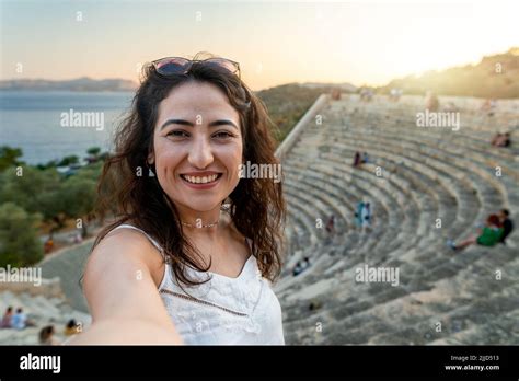 Beautiful Solo Lady Enjoying Sunset In Ancient Amphitheater Of Kaş