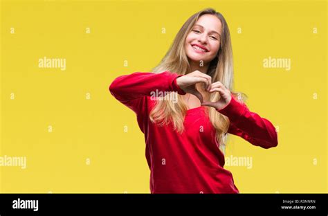 Young Beautiful Blonde Woman Wearing Red Sweater Over Isolated