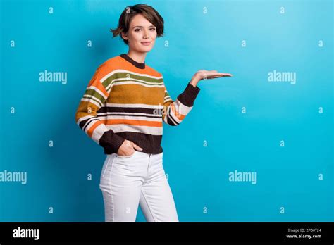 Photo Of Positive Good Mood Lady Wear Striped Sweater Showing Arm Empty