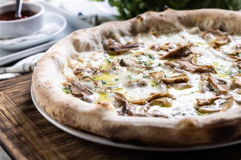 Mushroom Pizza With Cheese And Crusty Edges Taken Freshly Out Of Oven