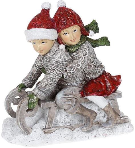 Статуэтка декоративная дети на санках 13 5см полистоун винтажный серый с красным — цена 755