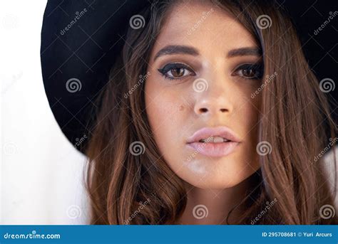 Stylishly Sensual Closeup Portrait Of An Attractive Young Woman Wearing A Hait Stock Image