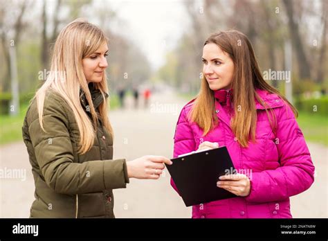 Opinion Poll A Woman Interviewing People Conducting Survey Standing