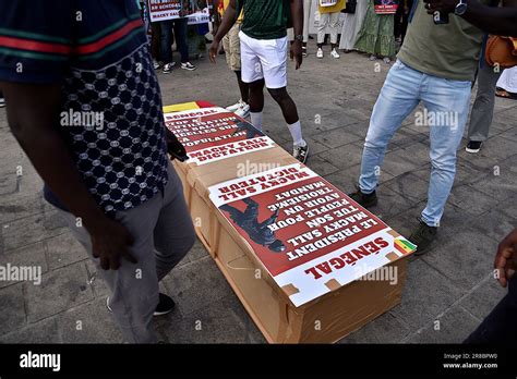 Protesters Drop A Fake Coffin On The Ground During The Demonstration