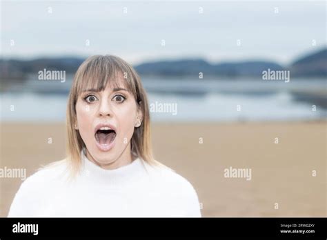 Captivating Beachside Surprise Beautiful Woman In White Sweater