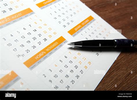 Wall Calendar With Pen Closeup And Macro Stock Photo Alamy