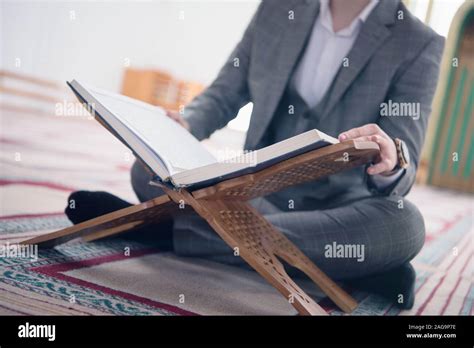 Religious Young Hafiz Muslim Man Praying Inside The Mosque And Reading