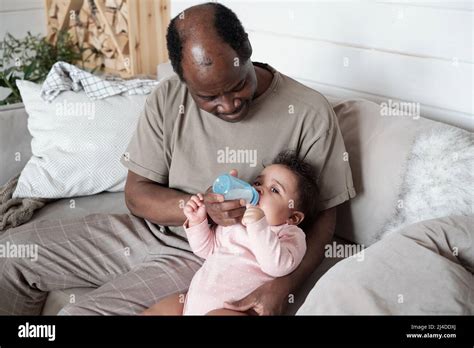 Bipoc Father Feeding Hi Res Stock Photography And Images Alamy