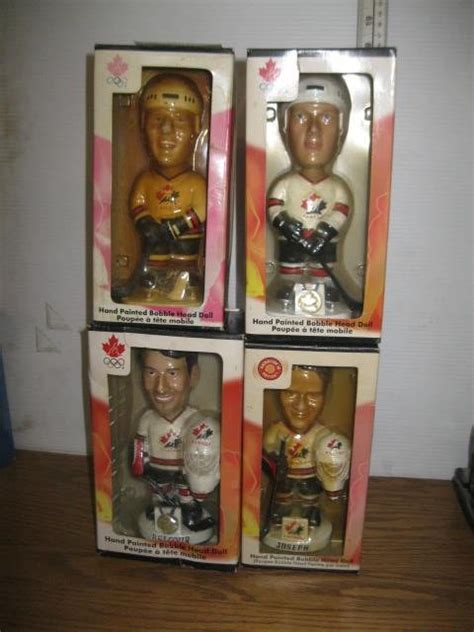 4 Bobble Head Dolls