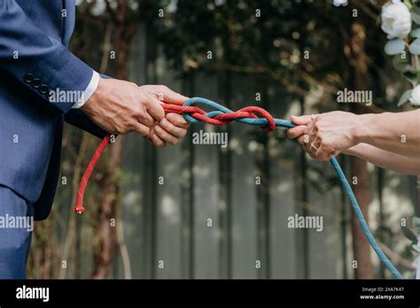 Woman Pulling Rope With Hands Stretched Out Stock Photo Alamy