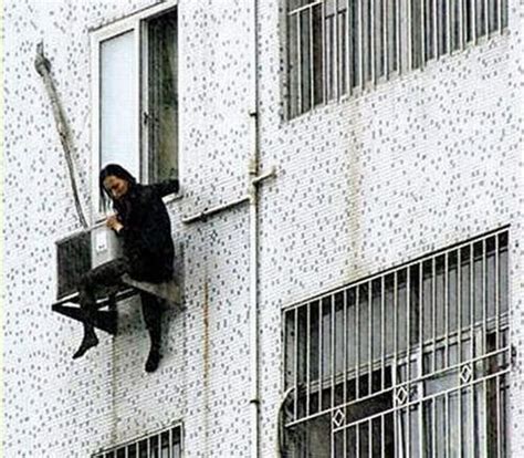 Suicide Girl Sitting On An Air Conditioner Pics