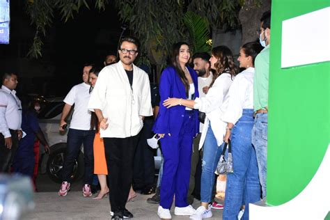 PHOTOS Sonam Kapoor Flaunts Her Growing Baby Bump Shares A Kiss With