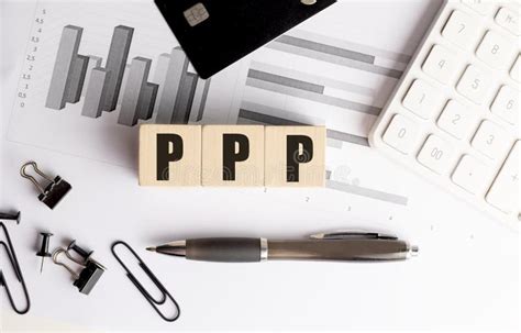 Ppp Abbreviation On Wooden Blocks With Financial Charts Credit Card Calculator And Office