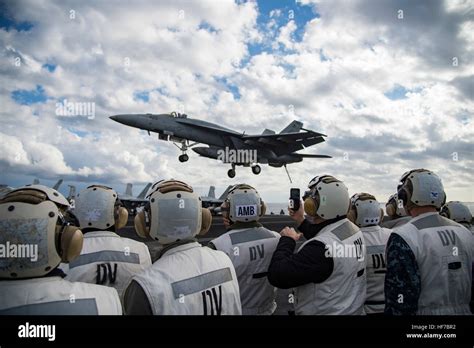 Spanish Visitors Observe A U S Navy F 18 Fighter Landing During Flight