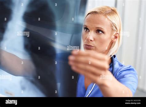 Taking A Closer Look At The Problem A Beautiful Young Doctor Examining