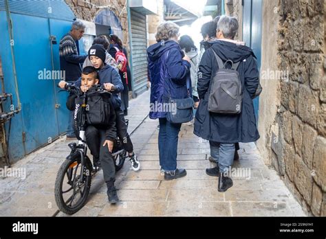 Akko Israel January 25 2025 A Boy Is Riding His Bike With His