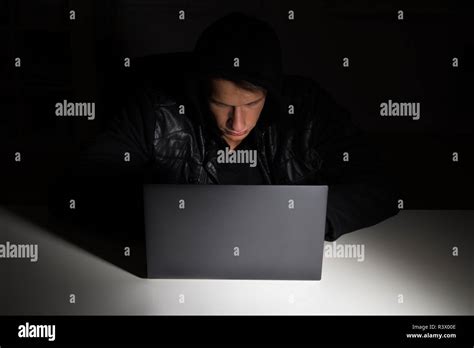 Hacker Stealing Data From Laptop Stock Photo Alamy