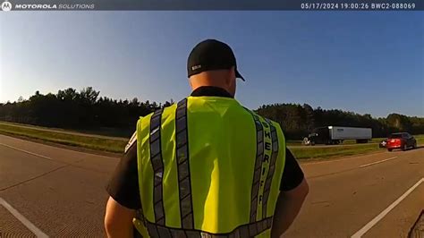 Bodycam Shows Driver Nearly Hitting Officer On The Side Of The Road