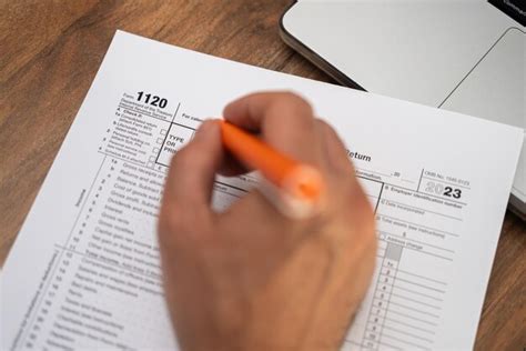 Premium Photo Closeup Of A Hand Filling Out U S Corporation Income