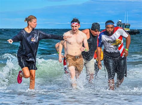 Polar Bearable Plungers Take Frozen Dip At Cedar Beach For A Good