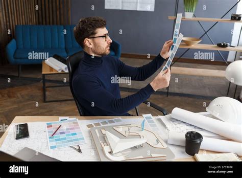 Architect Working In Office With Color Palette Engineer Select Colors