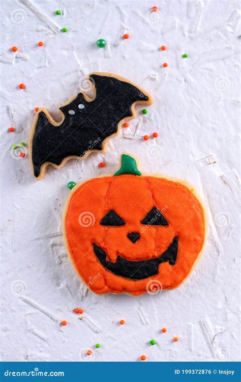 Top View Of Halloween Festive Decorated Icing Sugar Cookies On White
