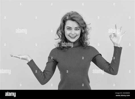 Cheerful Redhead Lady Making Choice Presenting Product With Copy Space For Advertisement Ok
