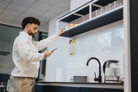 Stylish Businessman Preparing Morning Coffee In Modern Kitchen Stock